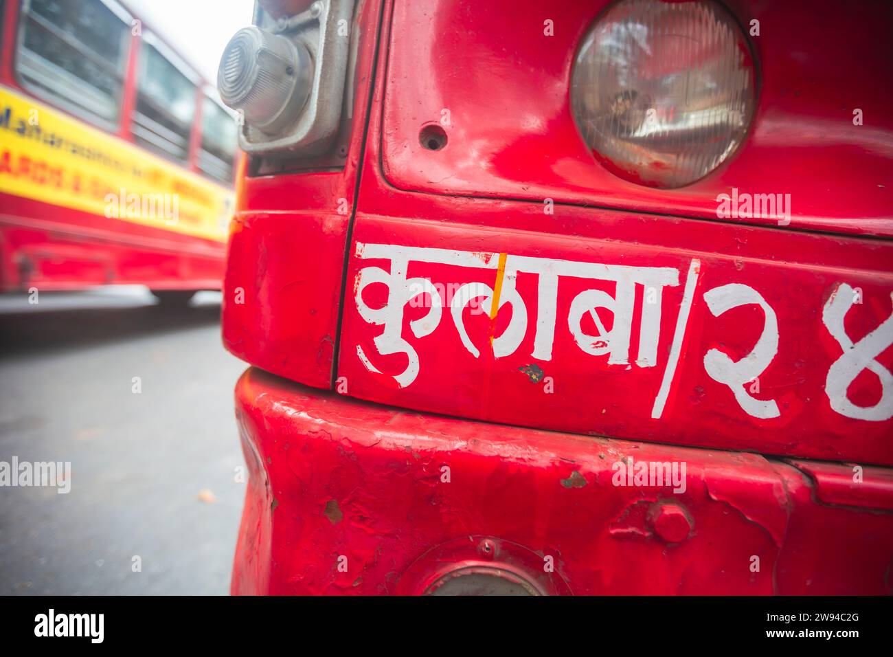 Closeup of a Best Bus at Colaba Mumbai. Colaba is written in Marathi on ...