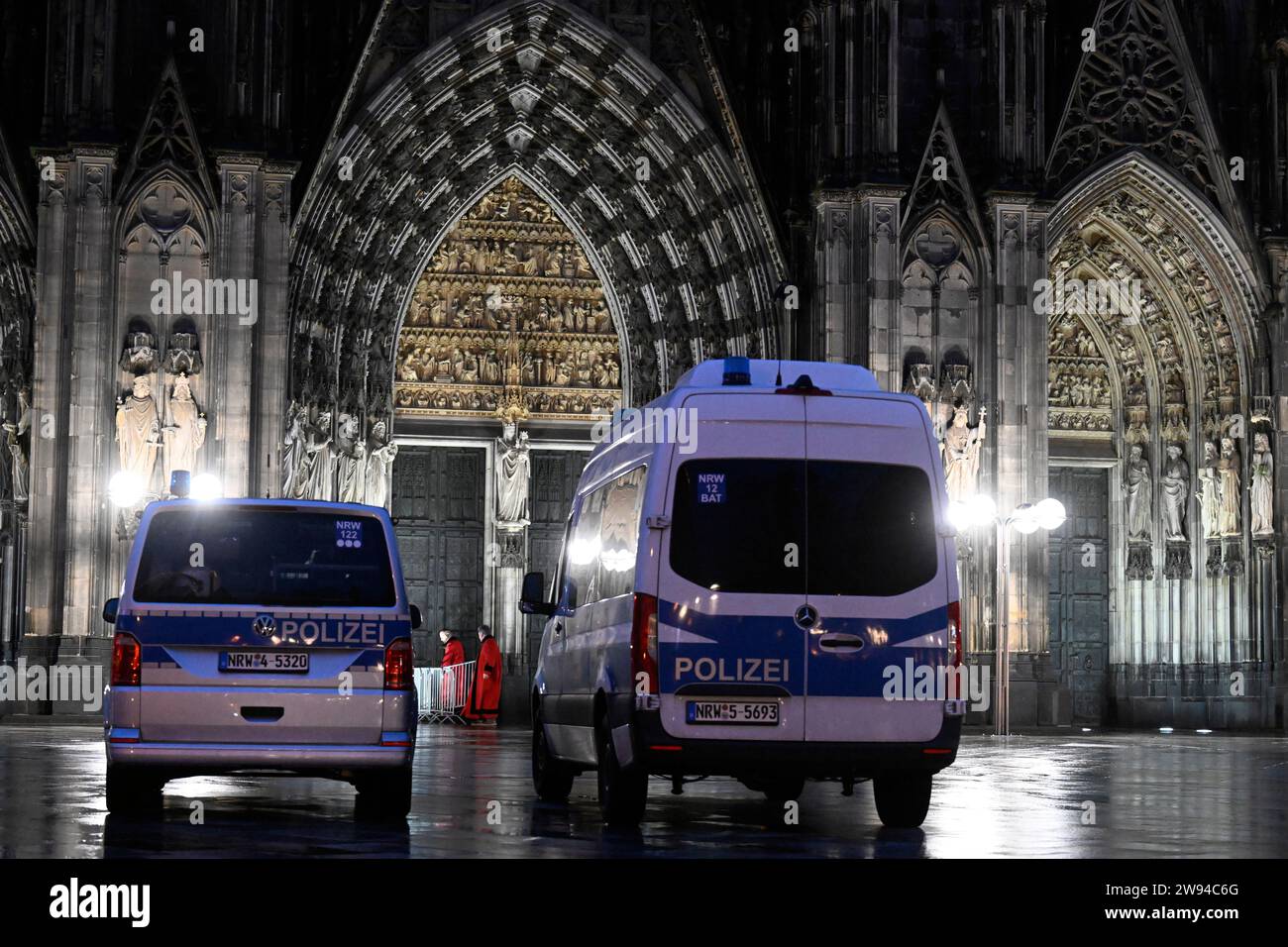 Police vans are parked at the entrance of Cologne Cathedral ahead of a ...
