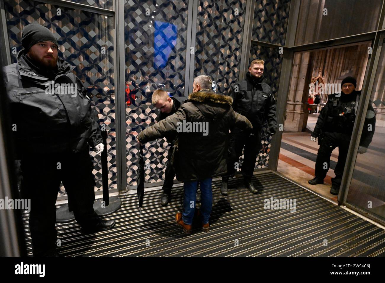 A man is searched at the entrance of Cologne Cathedral ahead of a ...