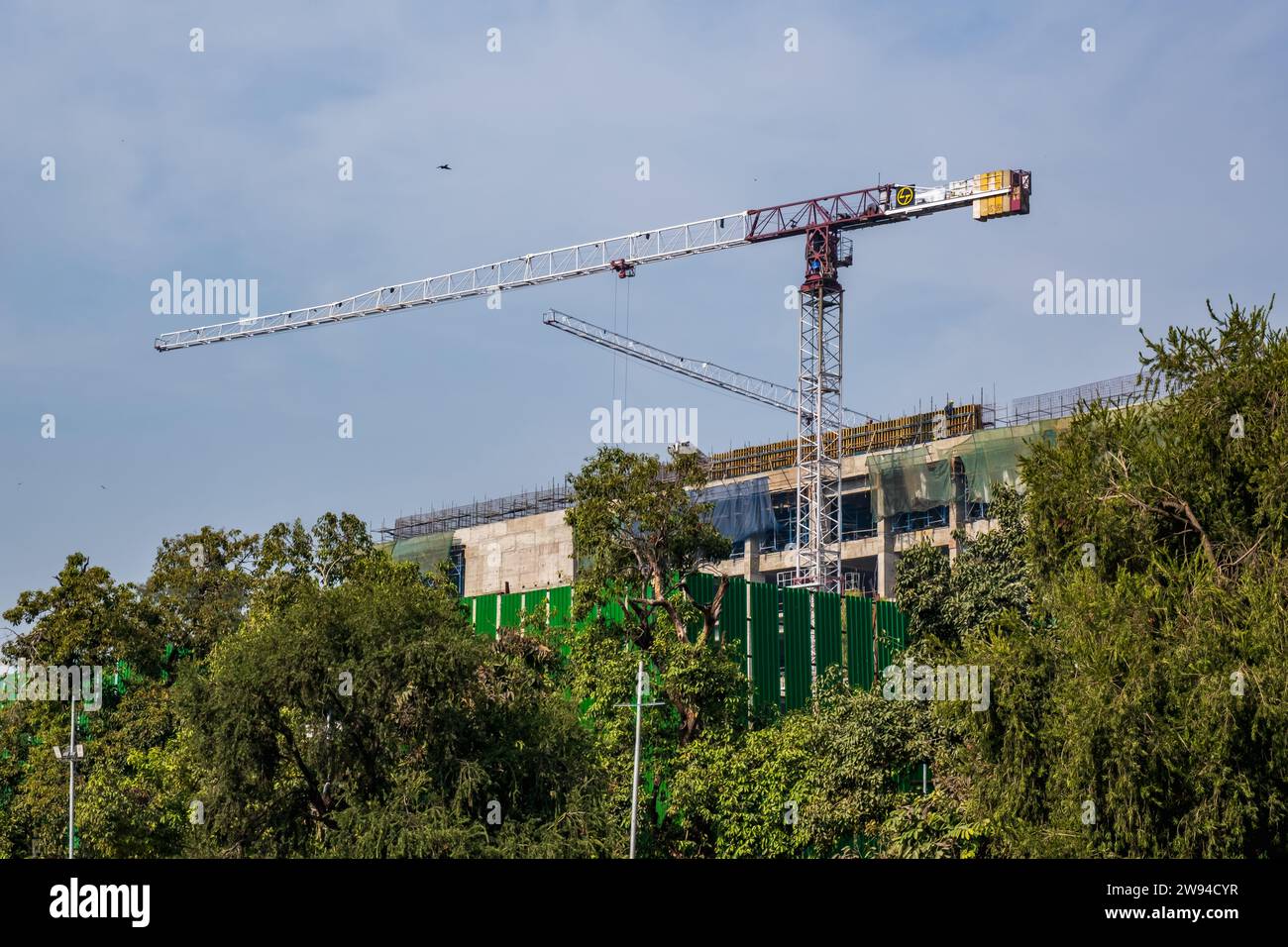 tower cranes on construction site, providing housing for low-income ...