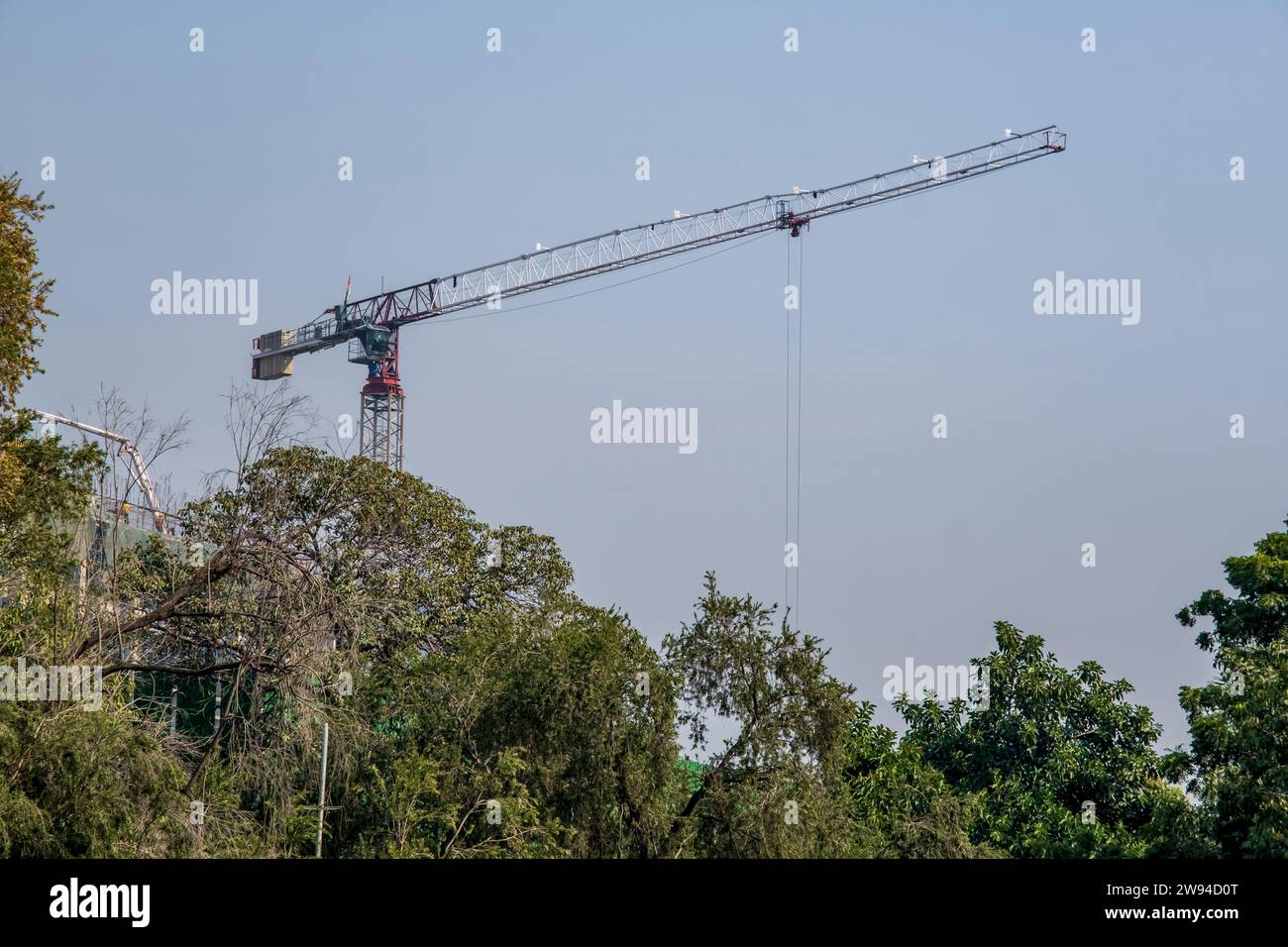 tower cranes on construction site, providing housing for low-income ...