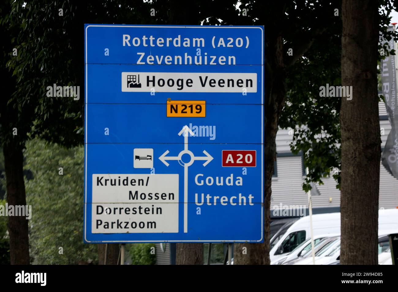 Blue direction signs on regional road N219 at junction to A20 motorway ...