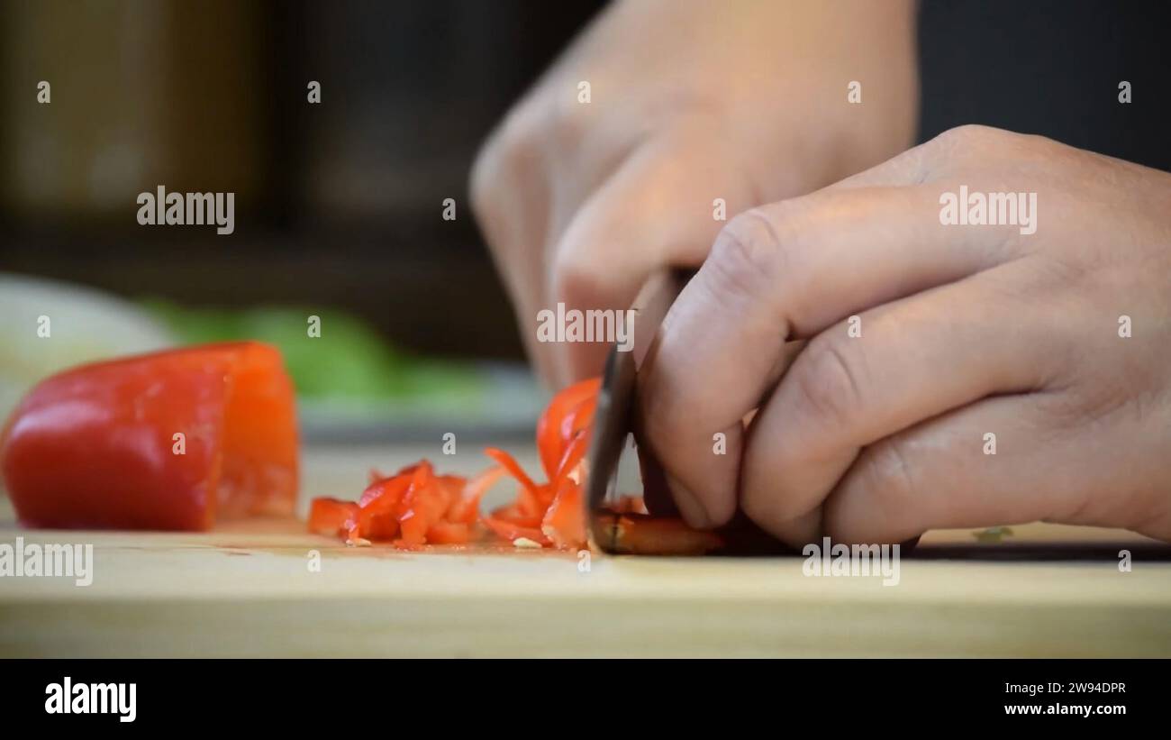 Chef skillfully cuts, chops, and slices a vibrant array of fresh ...