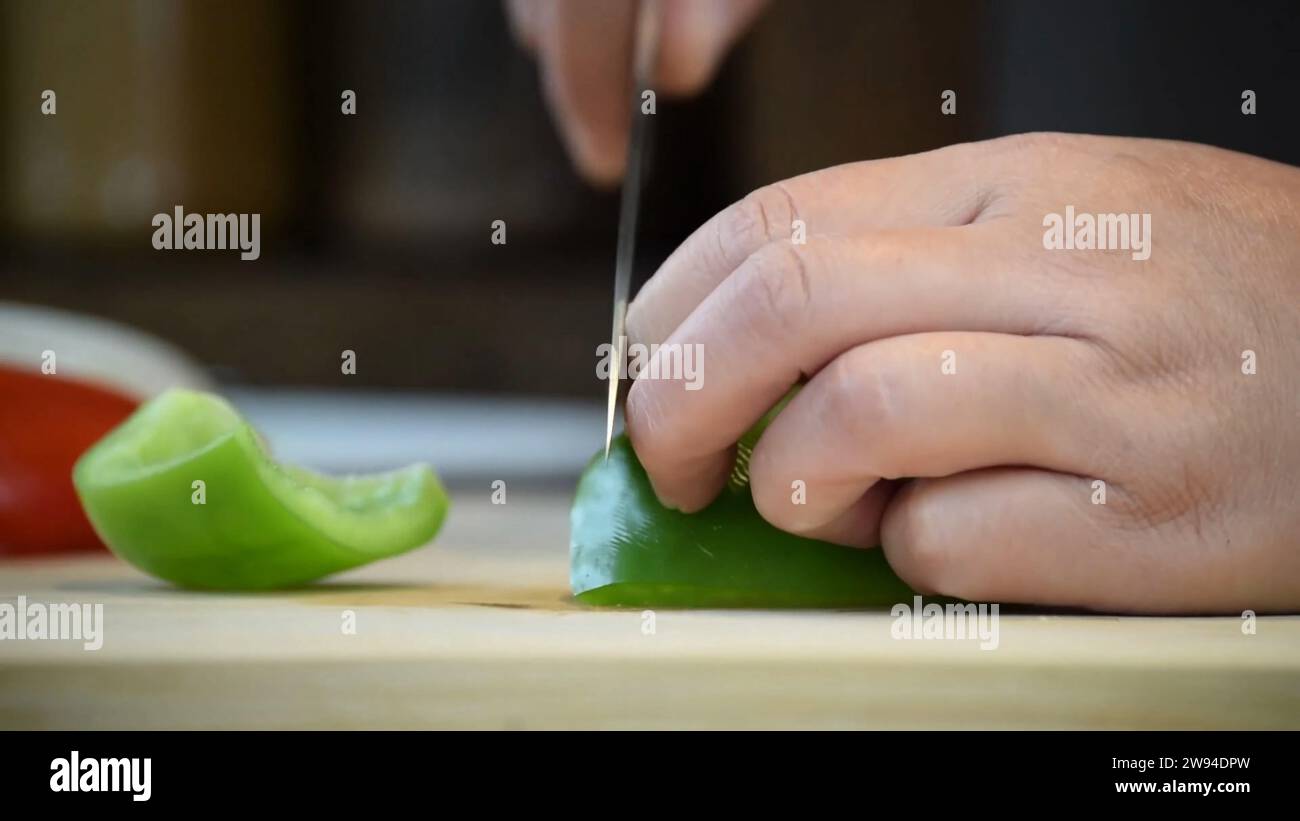 Chef skillfully cuts, chops, and slices a vibrant array of fresh ...