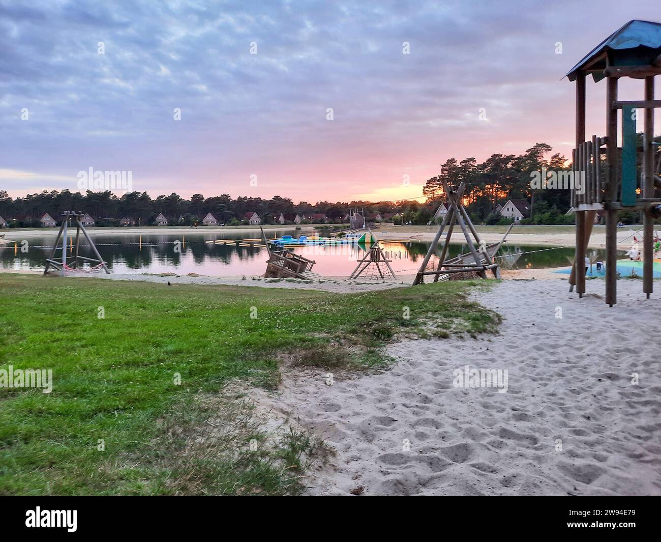 Recreation park with lake in forest with sand beaches and playground in ...