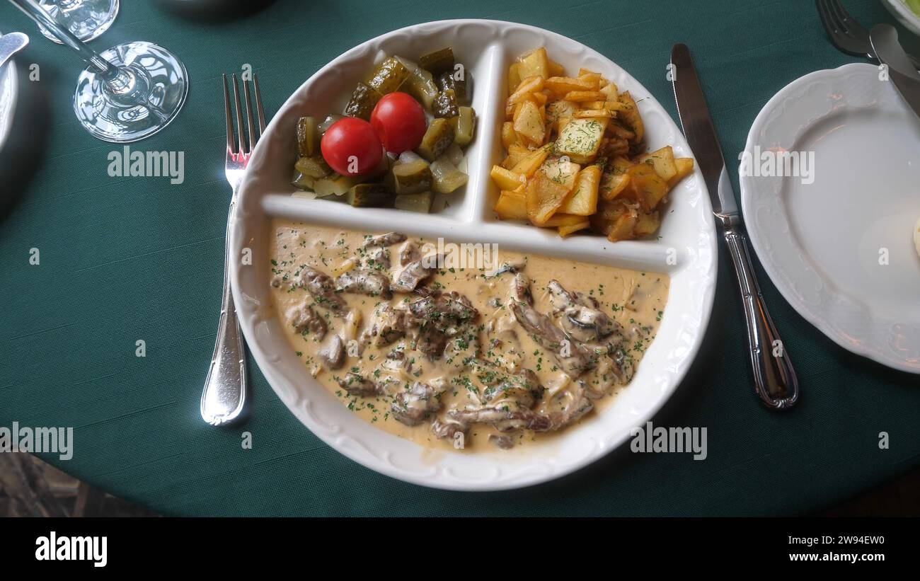 Stroganoff Russian food platter served on restaurant table Stock Photo ...