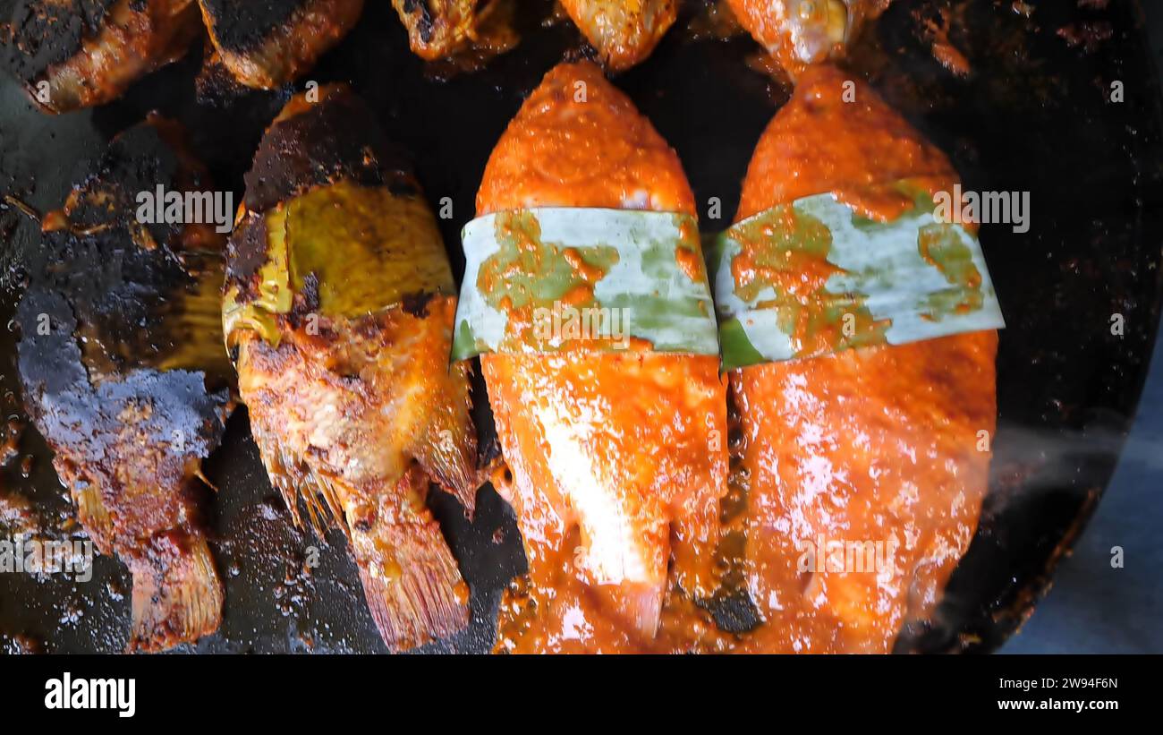 Grilled Fish street food of Malaysia Kuala Lumpur wrapped in banana ...