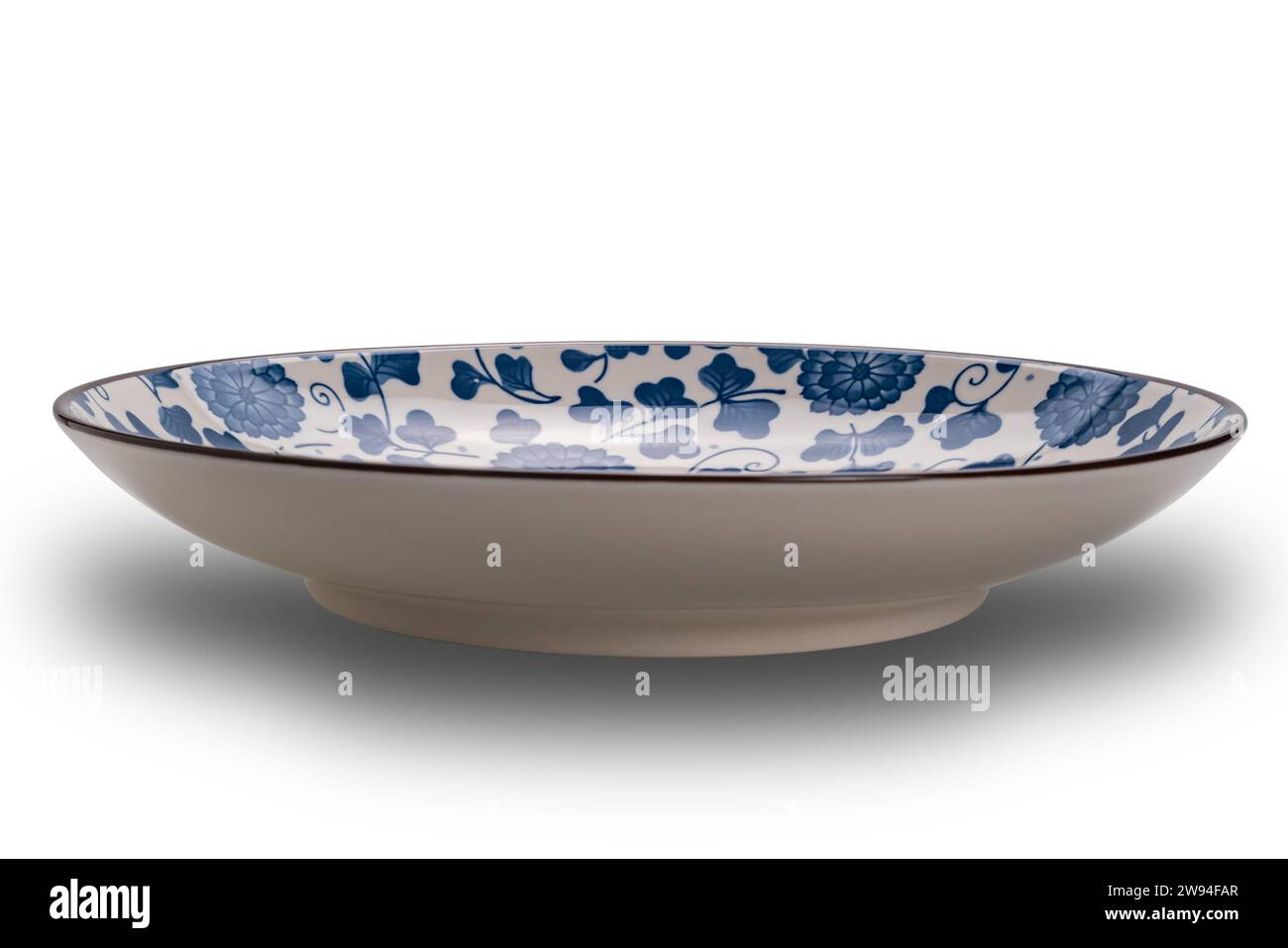 Side view of blue flowers pattern ceramic plate with black edge ...