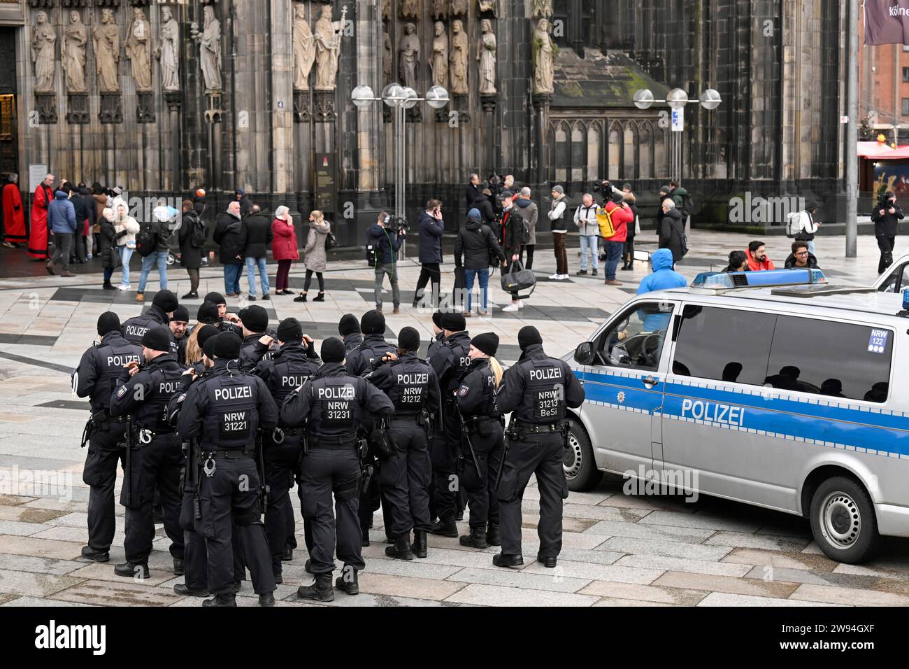 Police officers patrol the entrance of Cologne Cathedral ahead of a ...