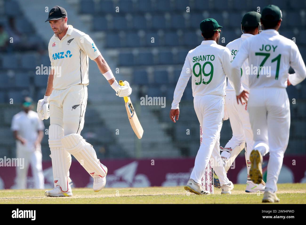 New Zealand captain Tim Southee walks on after dismisal by Taijul Islam ...
