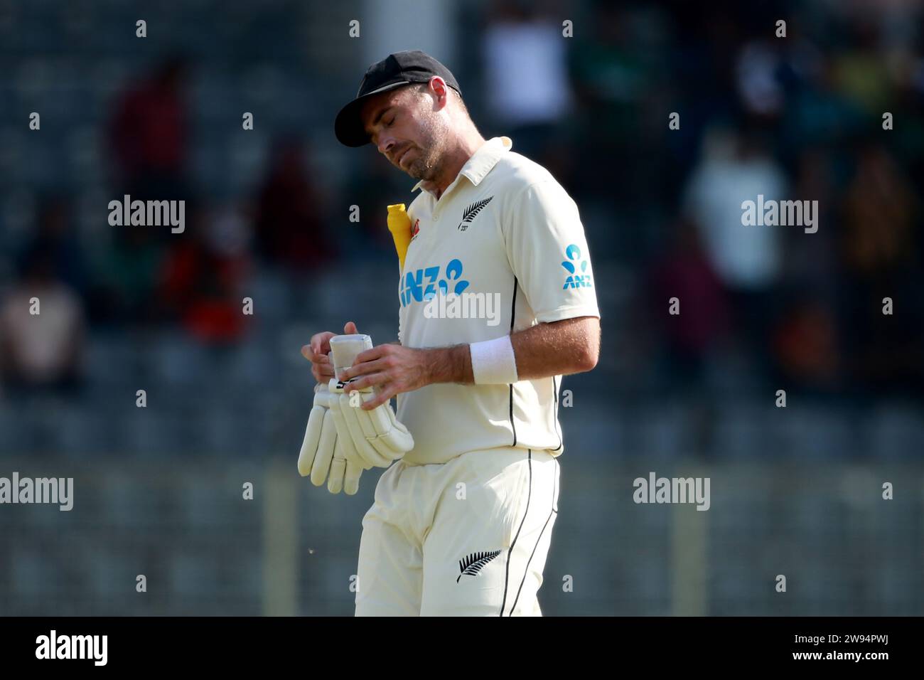 New Zealand captain Tim Southee walks on after dismisal by Taijul Islam ...