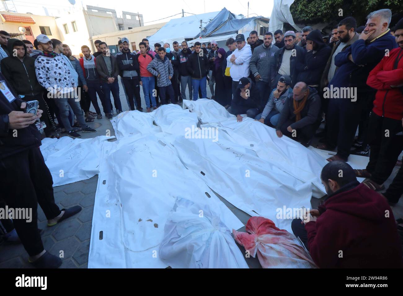 Relatives of the Palestinians died in Israeli attacks, mourn as they ...