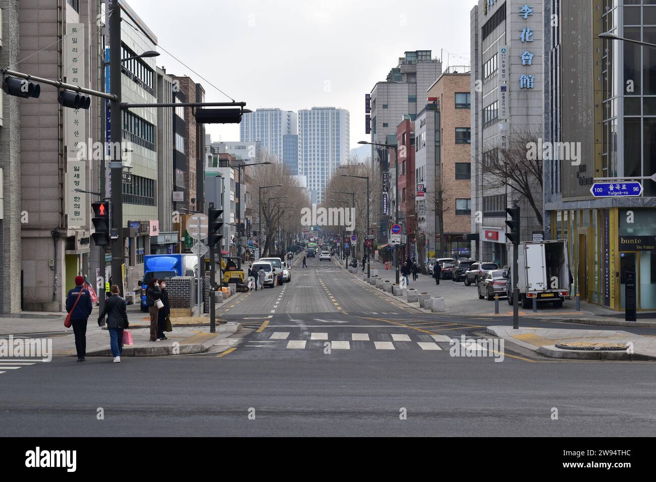 View of a street with trees and buildings branching of Yulgok road at ...