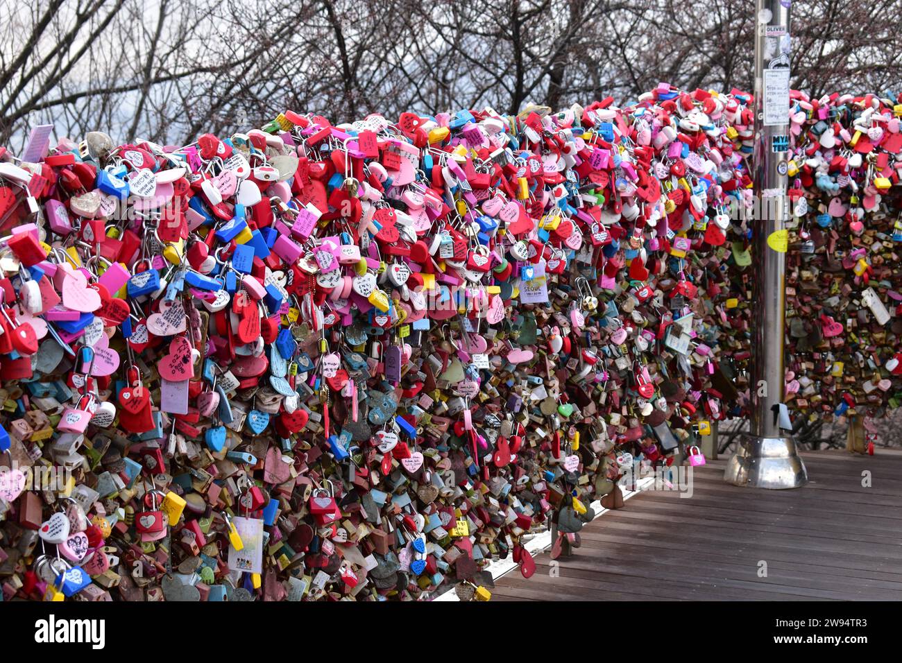 Colorful love locks with couples' names written on them, attached to ...