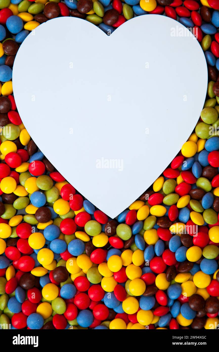 Heart shape inside smarties Stock Photo - Alamy
