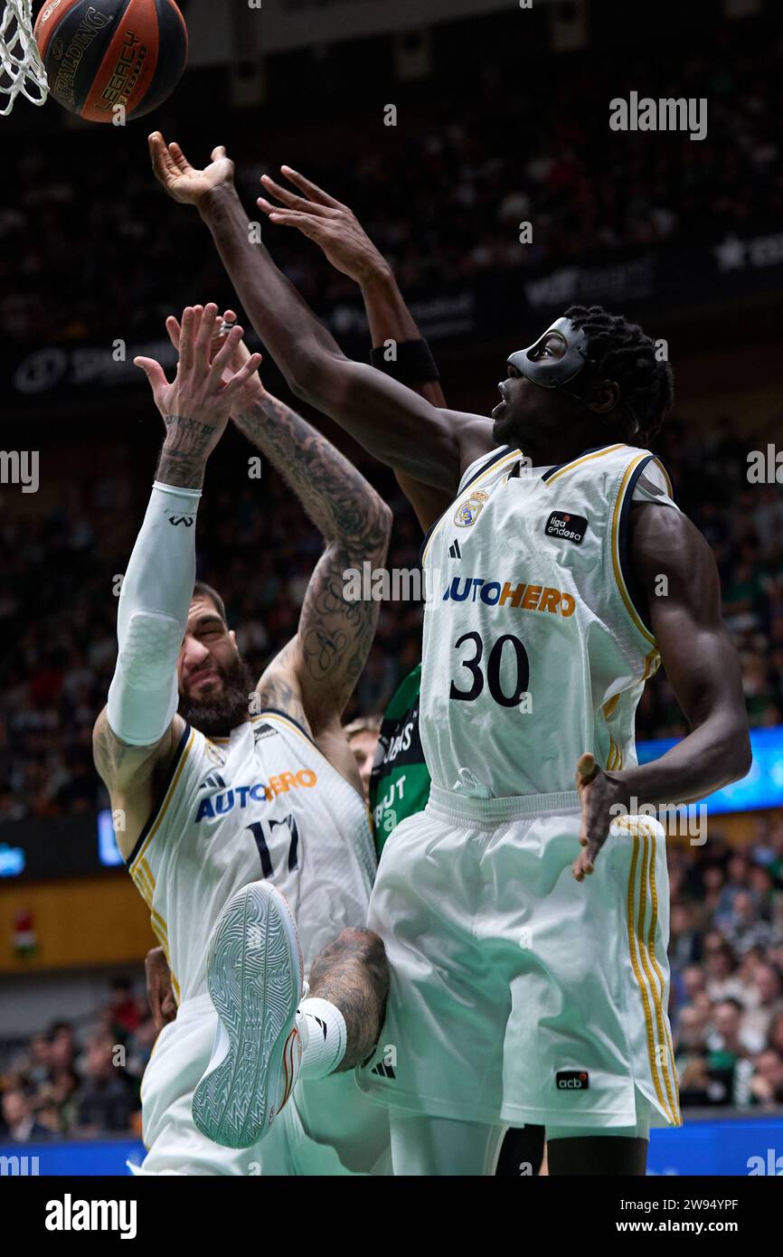Badalona, Barcelona. 23rd Dec, 2023. Eli John Ndiaye of Real Madrid with Vincent Poirier of Real ...