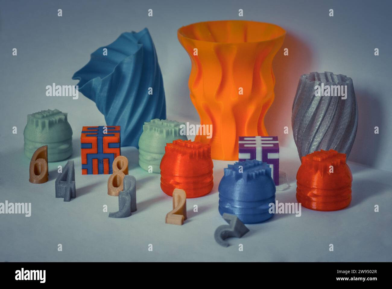 Models printed by 3d printer. Bright colorful objects printed on 3d ...