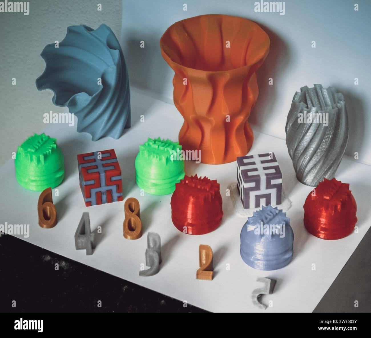 Models printed by 3d printer. Bright colorful objects printed on 3d ...