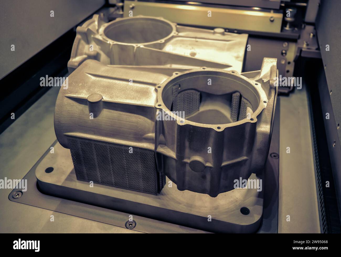 A model with supports created in a laser sintering machine stays in the ...