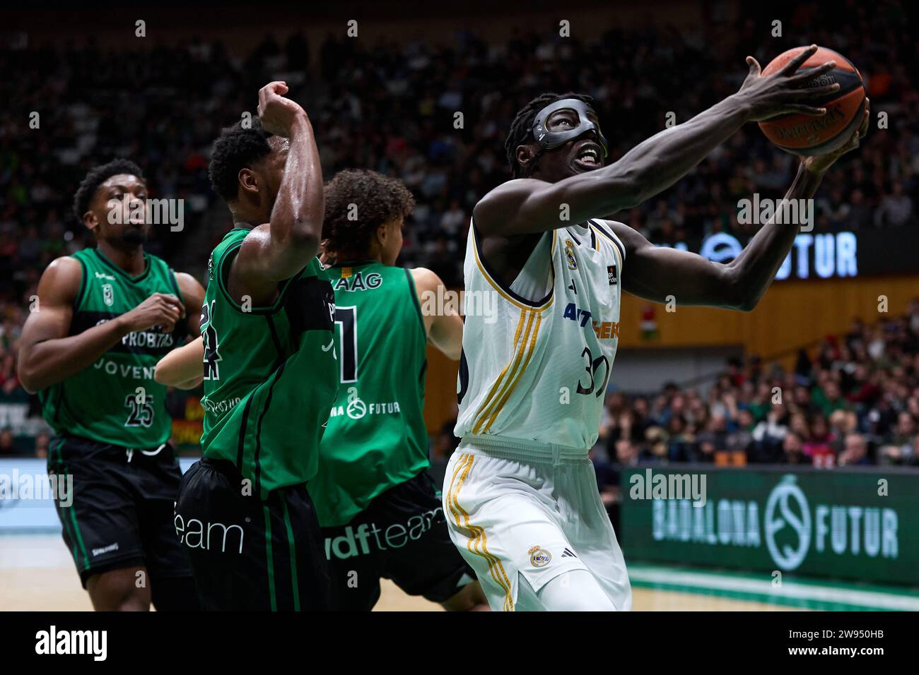 Badalona, Barcelona. 23rd Dec, 2023. Eli John Ndiaye of Real Madrid in action during the ACB ...