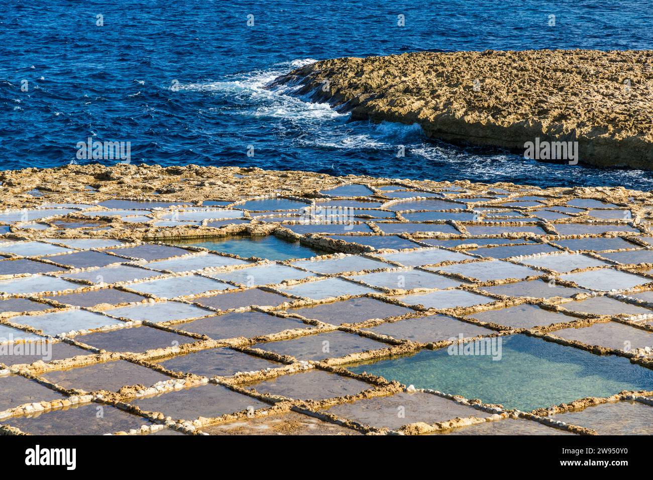 Salt pans on Gozo in Xwejni Bay. The tradition of salt production is ...