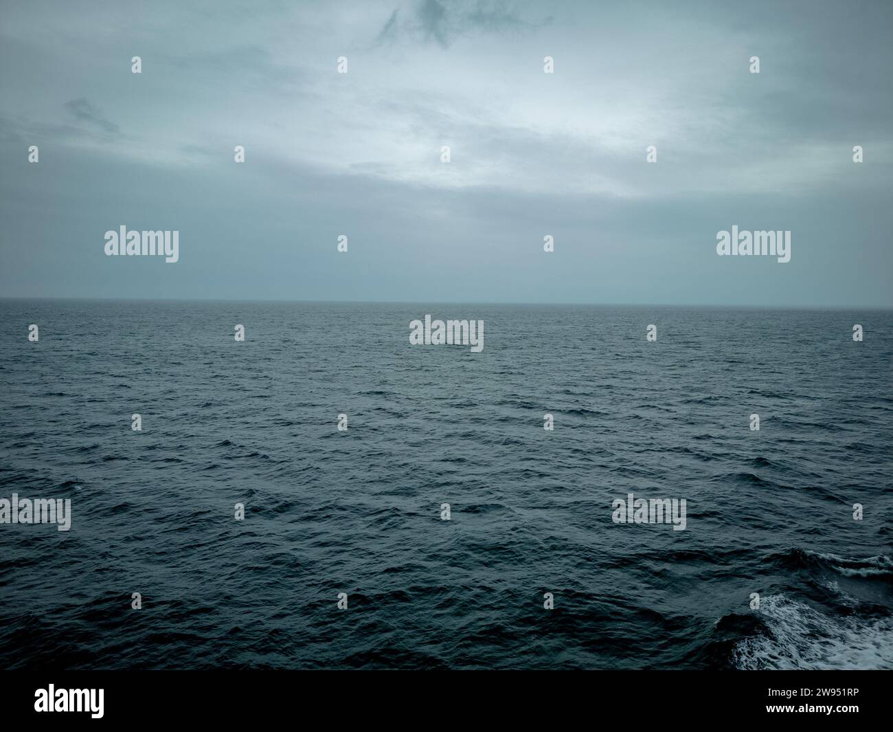 Sun with dark clouds over the baltic sea hi-res stock photography and ...