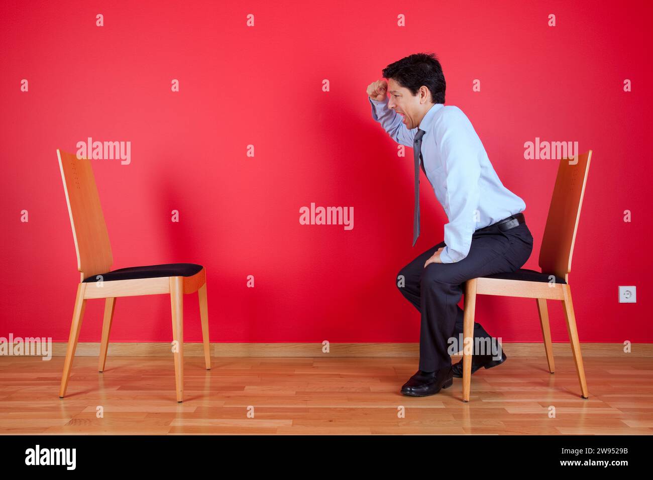 Businessman angry with an empty place Stock Photo - Alamy