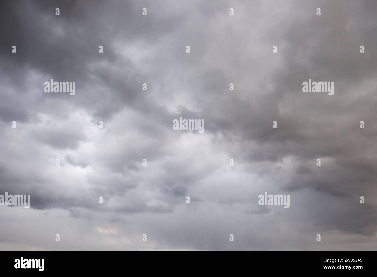 Heavy cloud cover with varying shades of grey indicates a storm is near ...