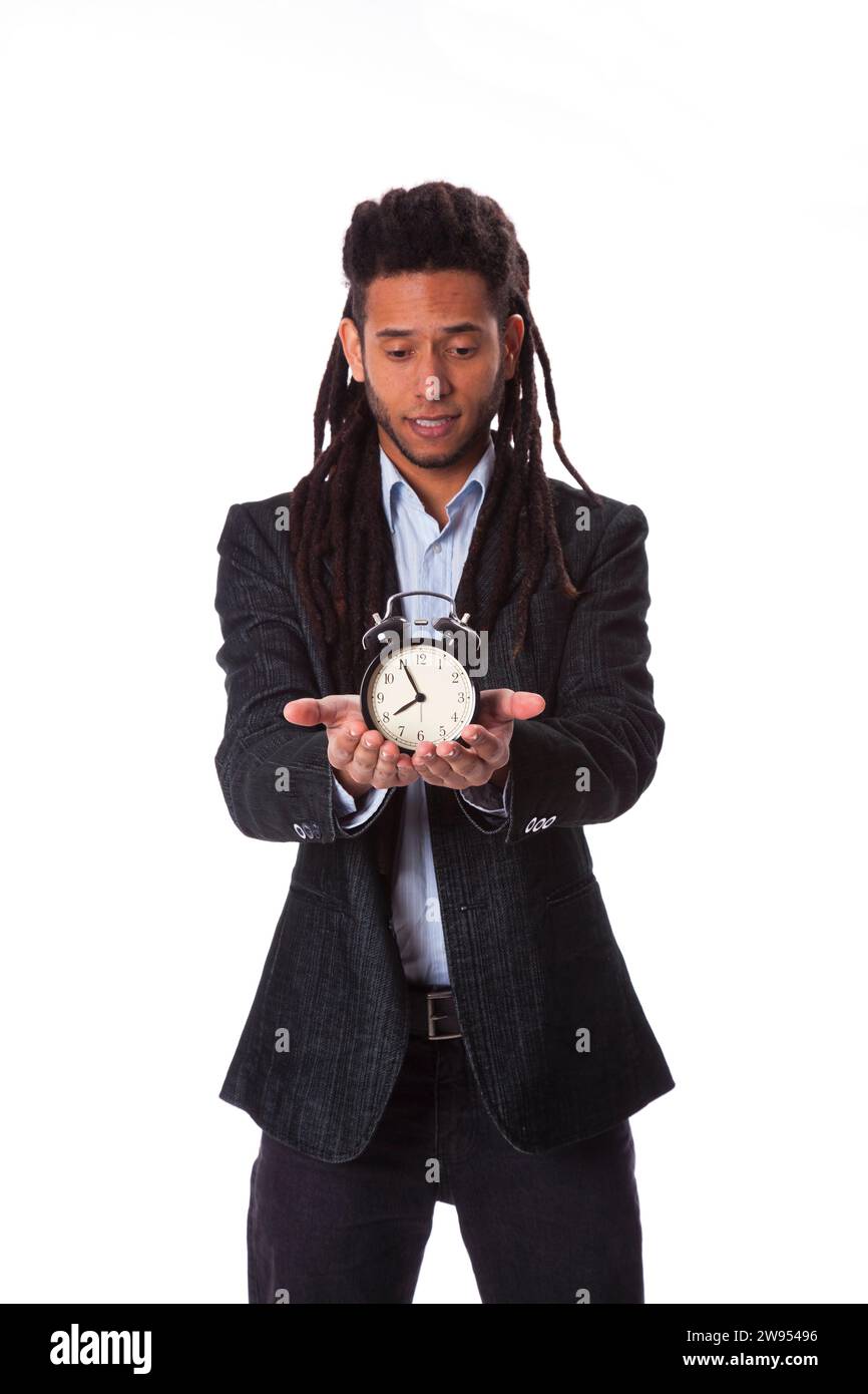 rastafari man holding a alarm clock Stock Photo - Alamy
