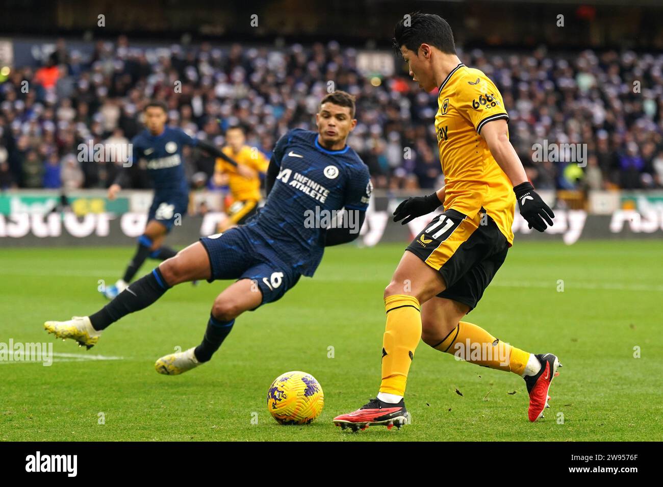 Wolverhampton Wanderers' Hwang Hee-Chan (right) and Chelsea's Thiago ...