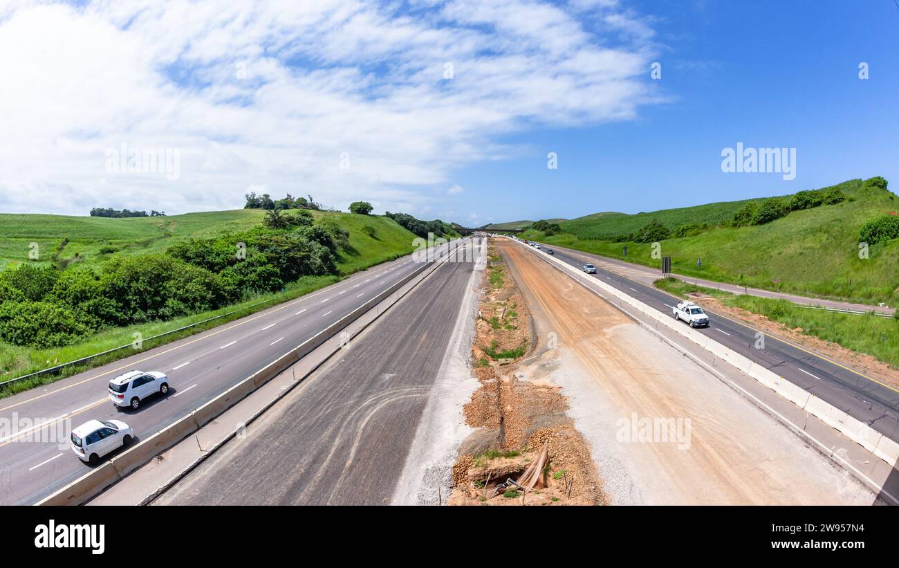 Driving road highway through construction expansion improvements with ...