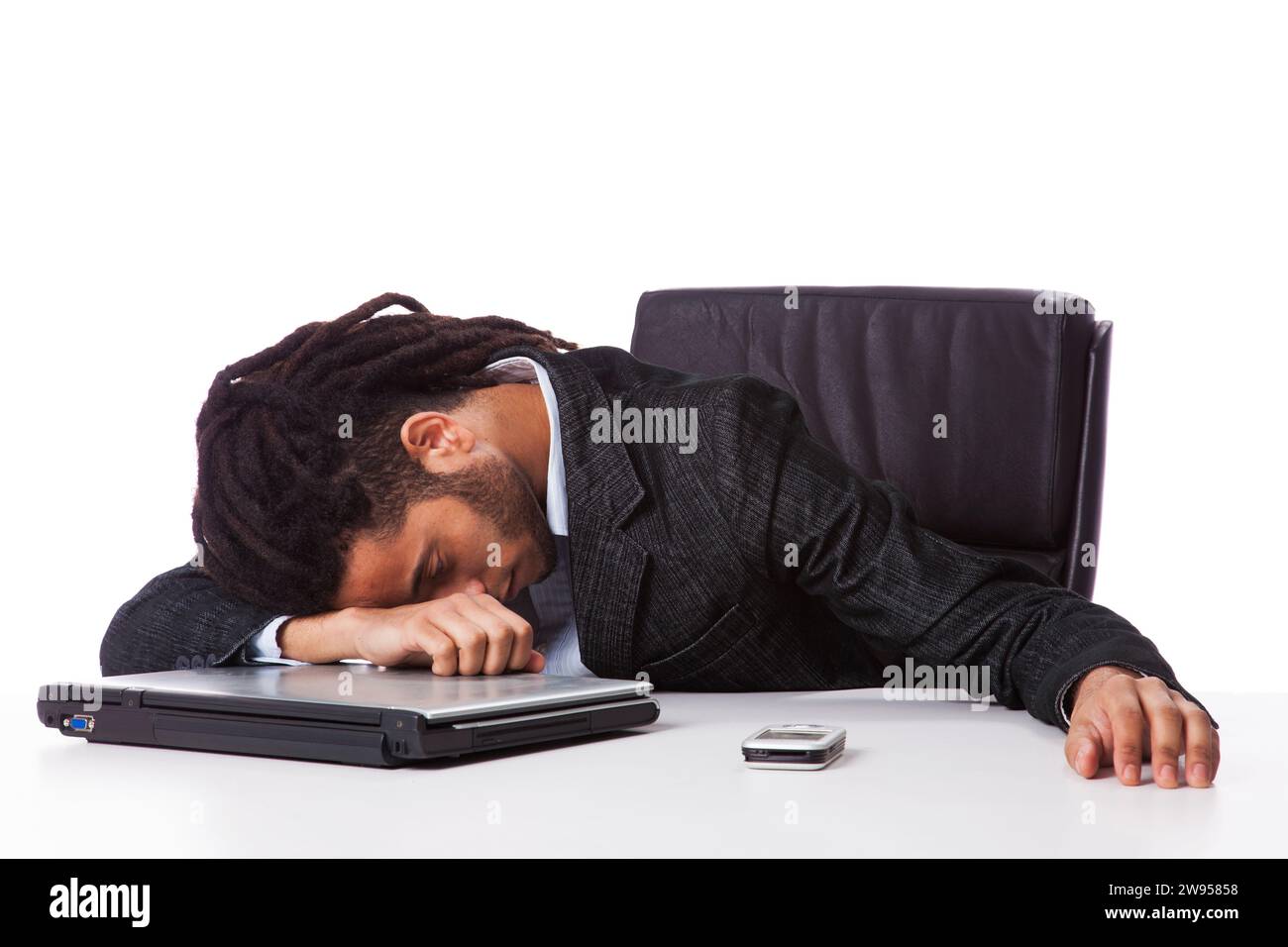 young man sleeping next to his laptop computer (with gray background ...