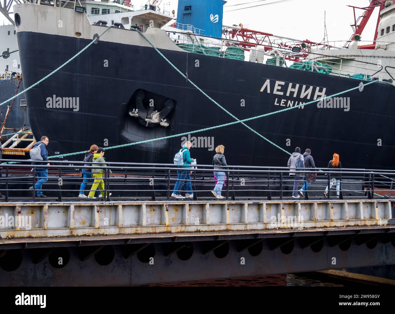 Murmansk, Russia - June 22, 2022: People walk along the pier to the ...