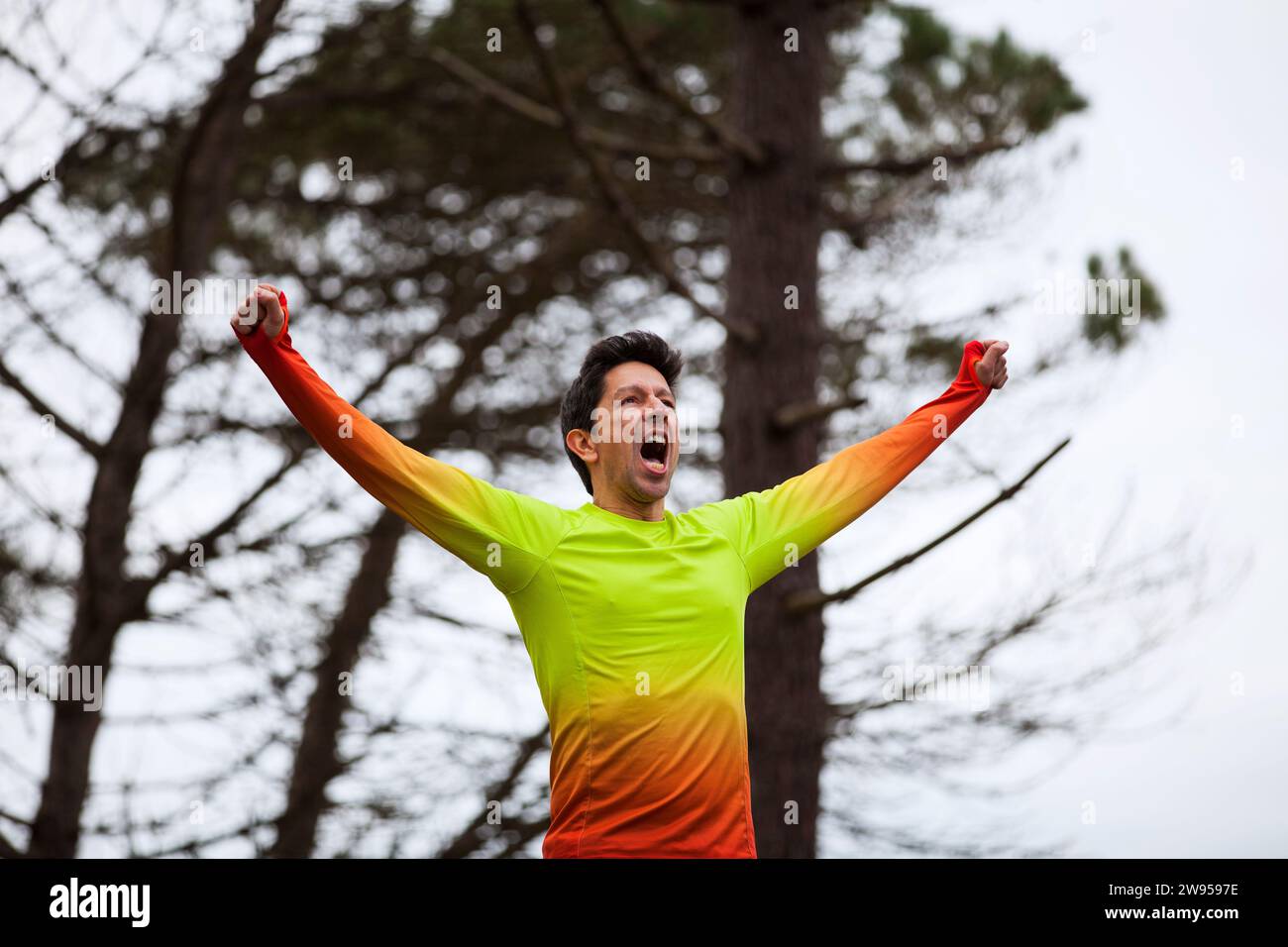 Running celebrating runner hi-res stock photography and images - Alamy