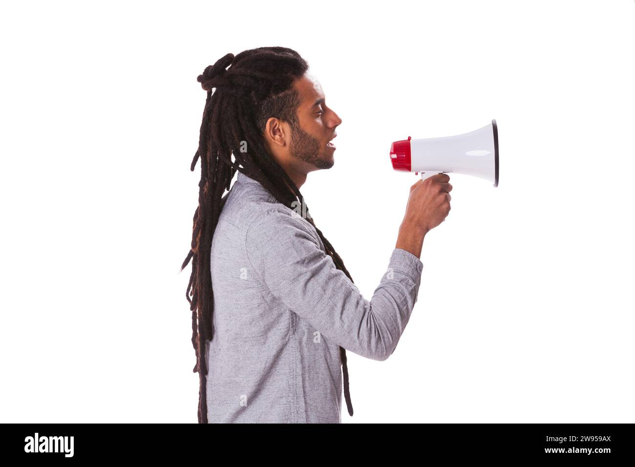Handsome rastafari man speaking over the megaphone Stock Photo - Alamy