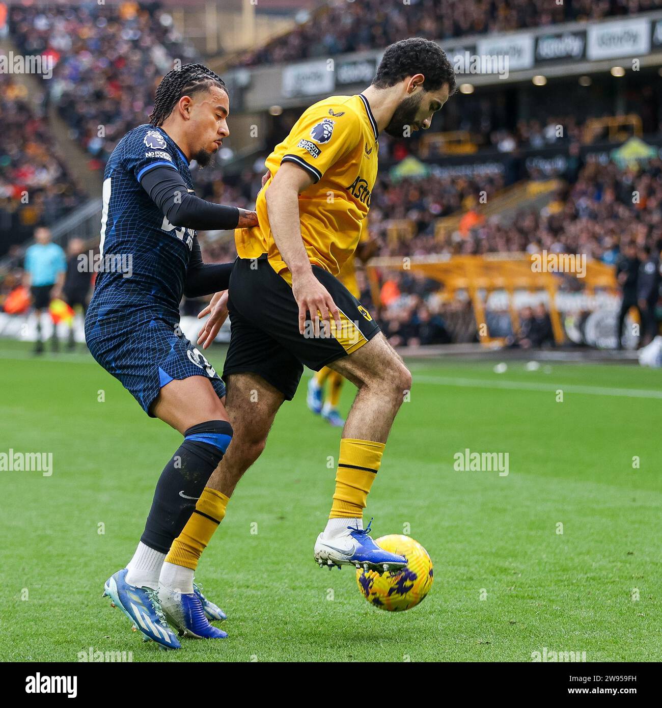 Wolverhampton, UK. 24th Dec, 2023. Chelsea's Malo Gusto & Wolves' Rayan ...