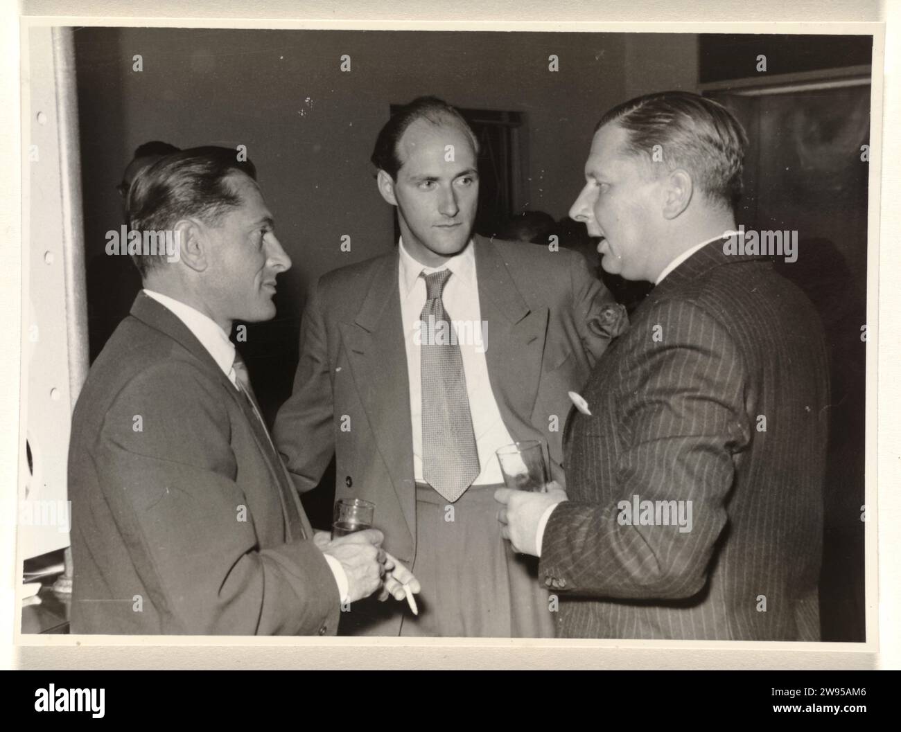 Gideon Elon in conversation with two unknown men, during a reception ...