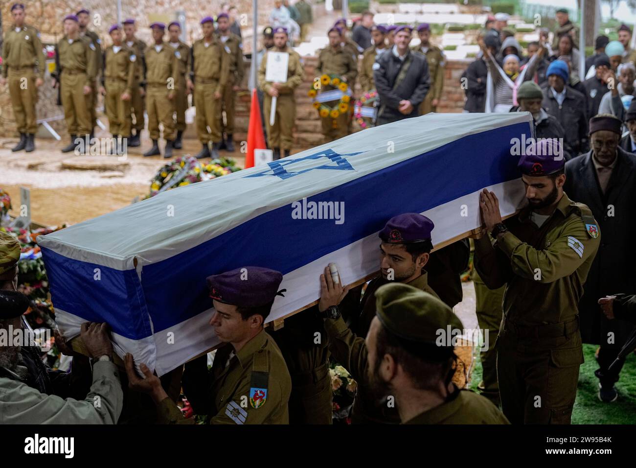 Israeli soldiers carry the flag-draped casket of Staff Sgt. Birhanu ...