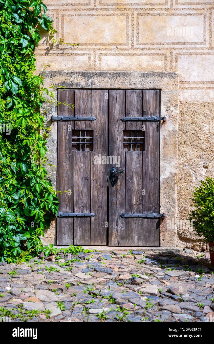 Small vintage wooden castle door Stock Photo - Alamy