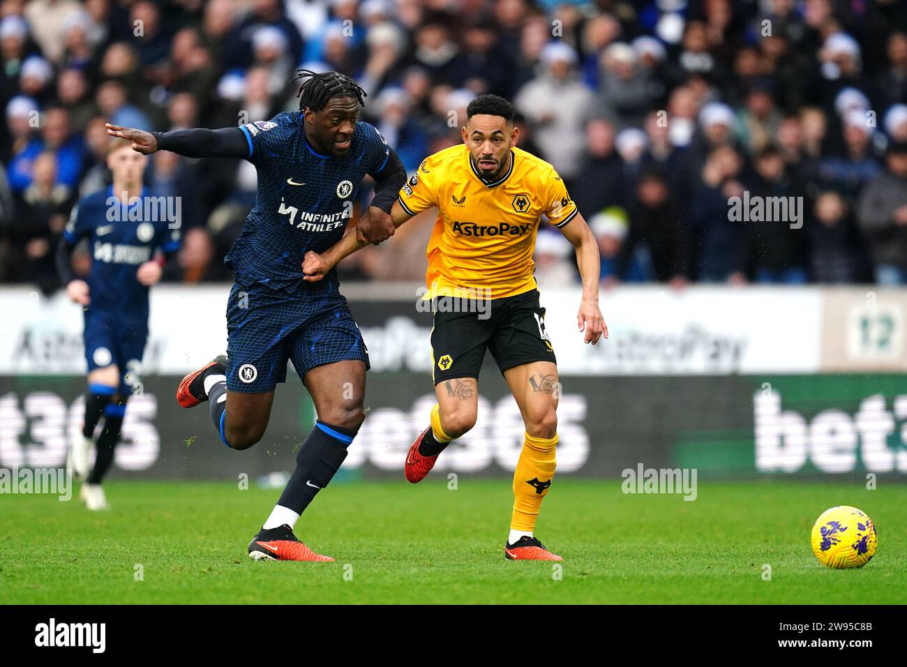 Chelsea's Axel Disasi (left) and Wolverhampton Wanderers' Matheus Cunha ...