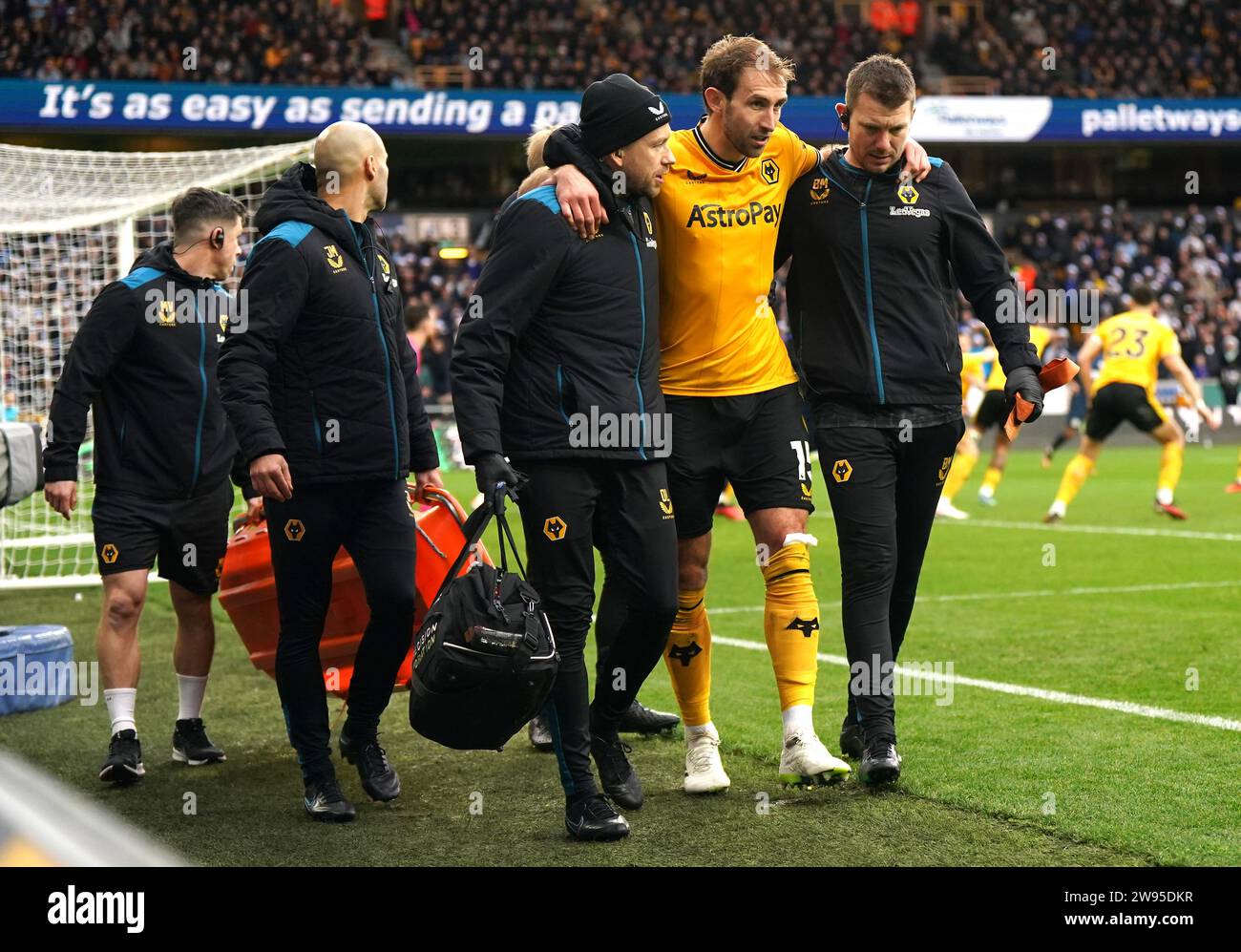 Wolverhampton Wanderers' Craig Dawson is helped off the pitch after ...