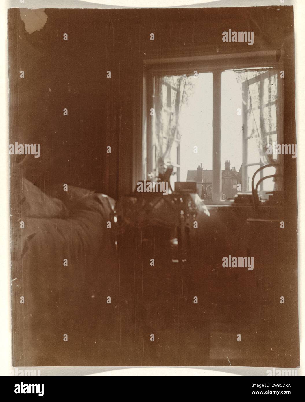 Room, with bed, table with attributes placed on top and open windows ...