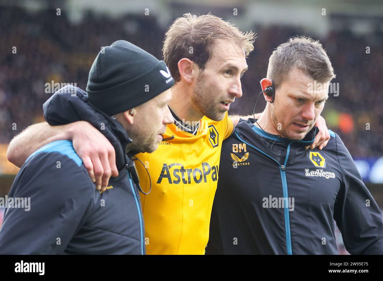 Wolverhampton, UK. 24th Dec, 2023. Wolves' Craig Dawson is assisted off ...