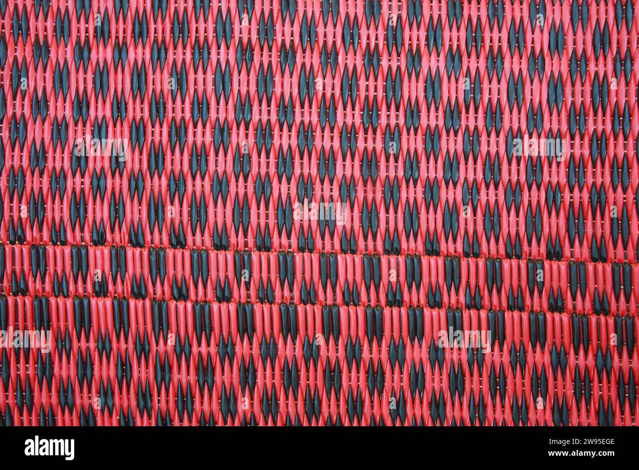 red and black plastic mats pattern background Stock Photo - Alamy