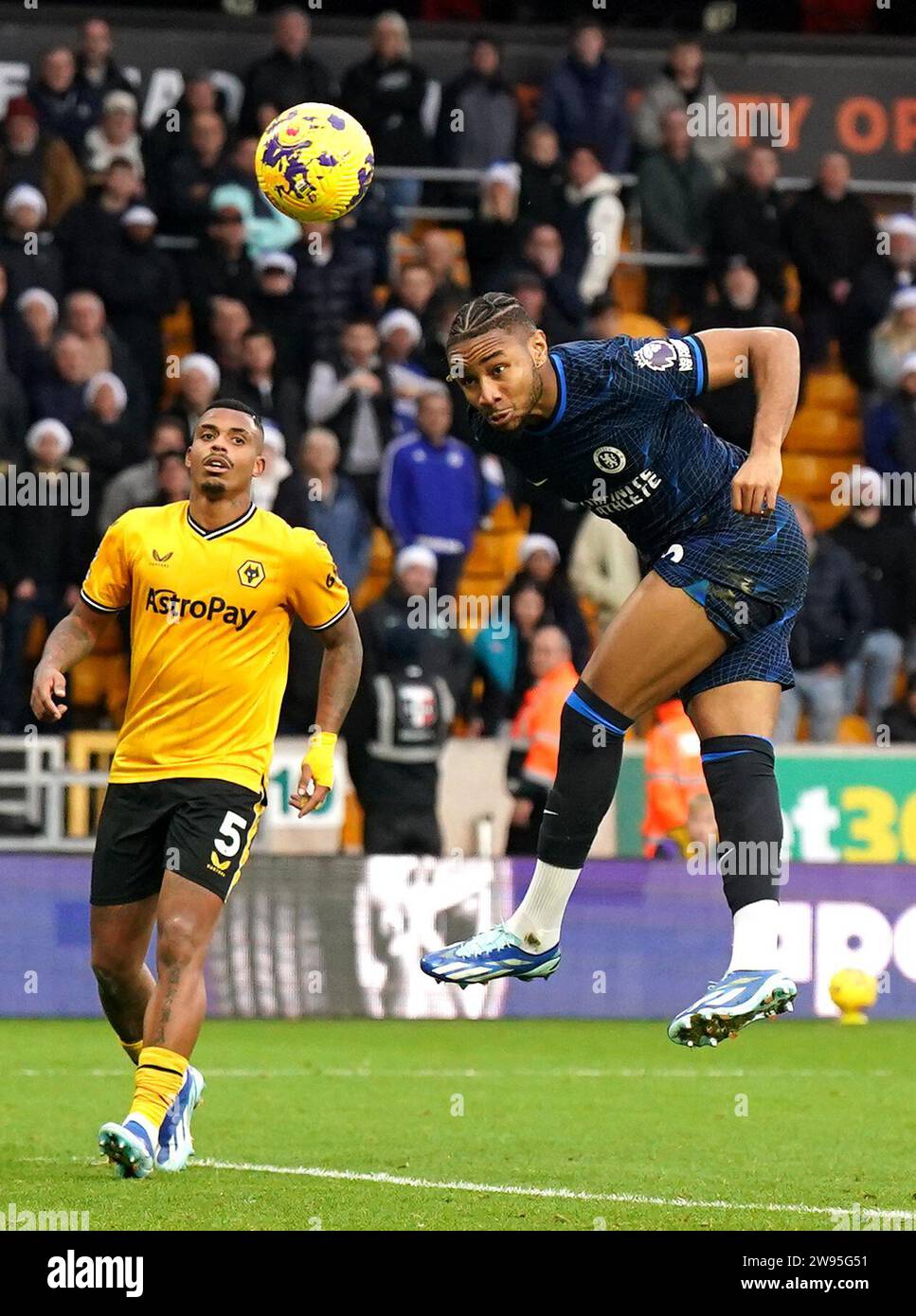 Chelsea's Christopher Nkunku (right) scores their side's first goal of ...