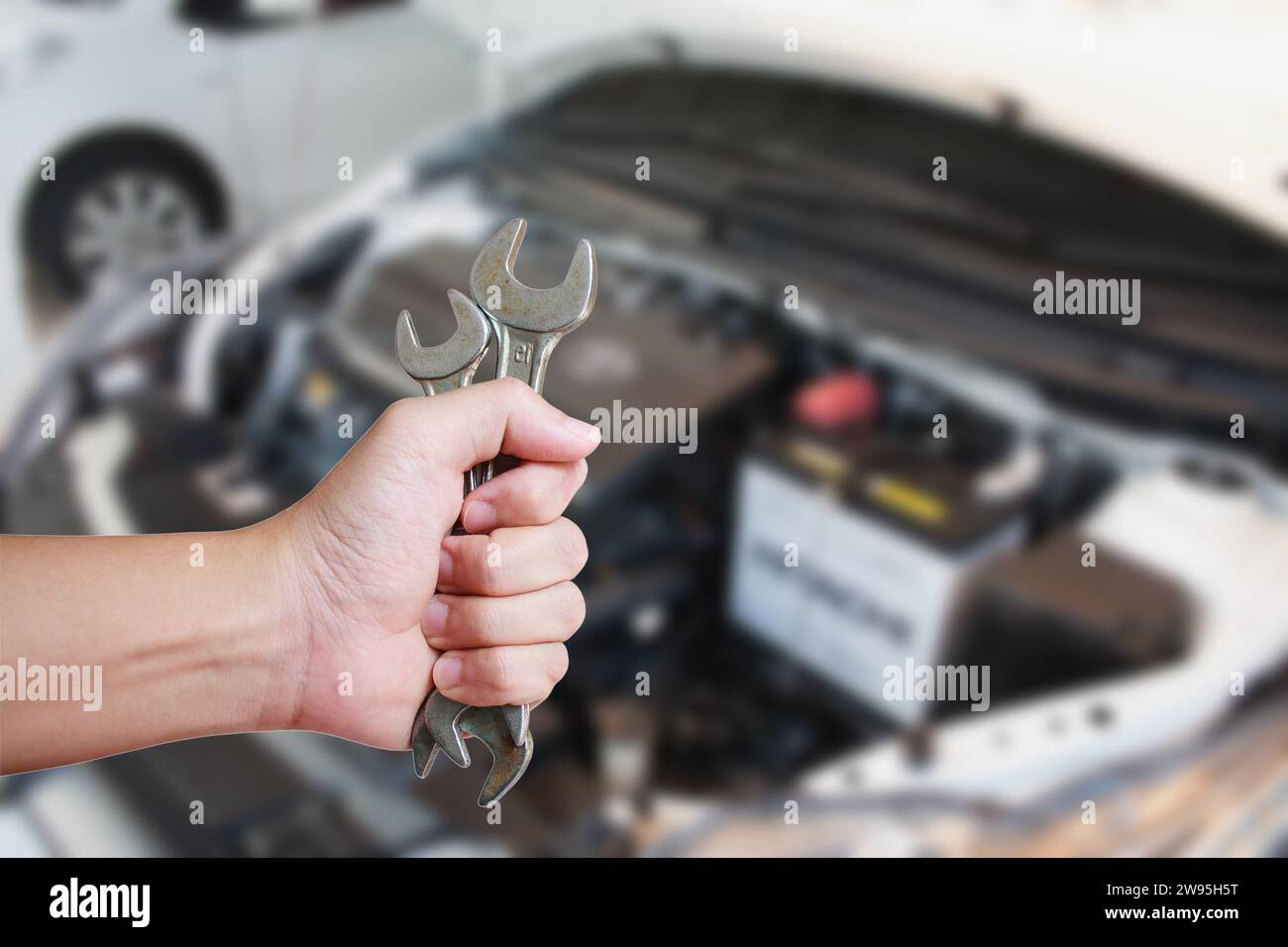 Mechanic Holding Spanner Fixing Car Engine Stock Photo - Alamy