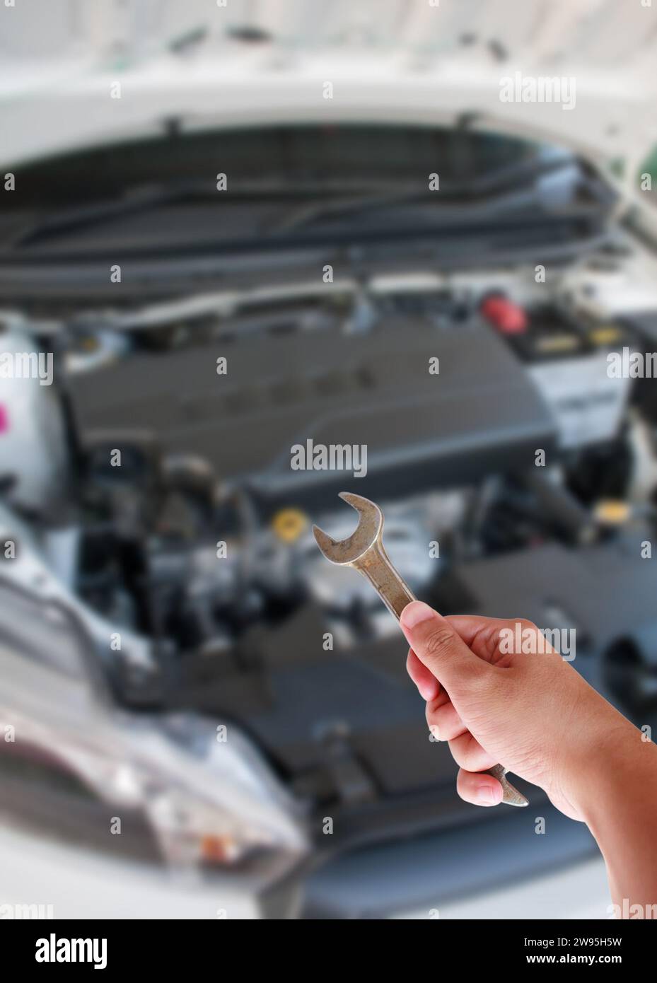 Mechanic Holding Spanner Fixing Car Engine Stock Photo - Alamy