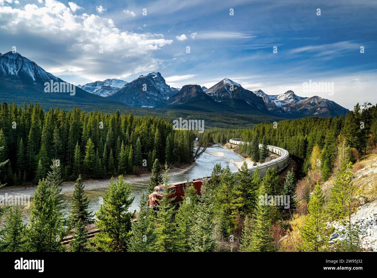 Freight train passes through Canadian Rockies Stock Photo - Alamy