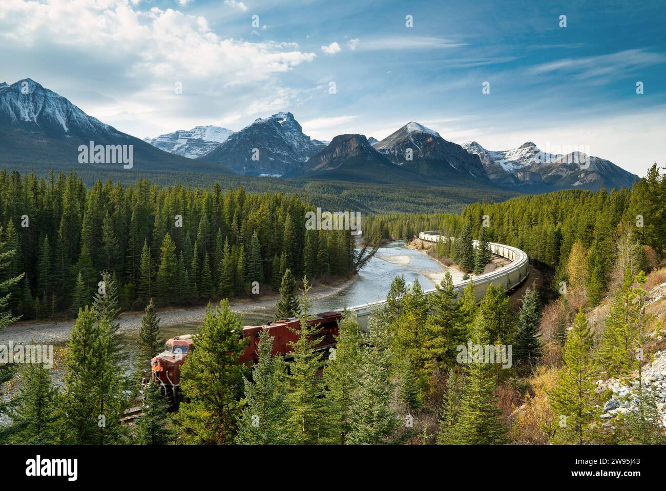 Freight train passes through Canadian Rockies Stock Photo - Alamy