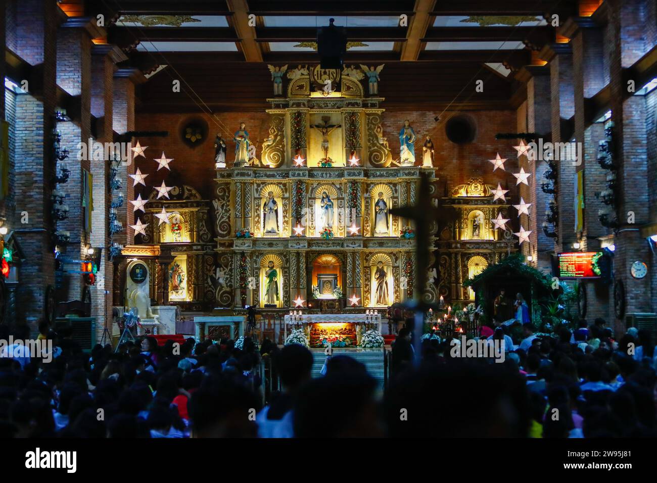 Boac, Marinduque, The Philippines. 25th Dec, 2023. People attend a ...